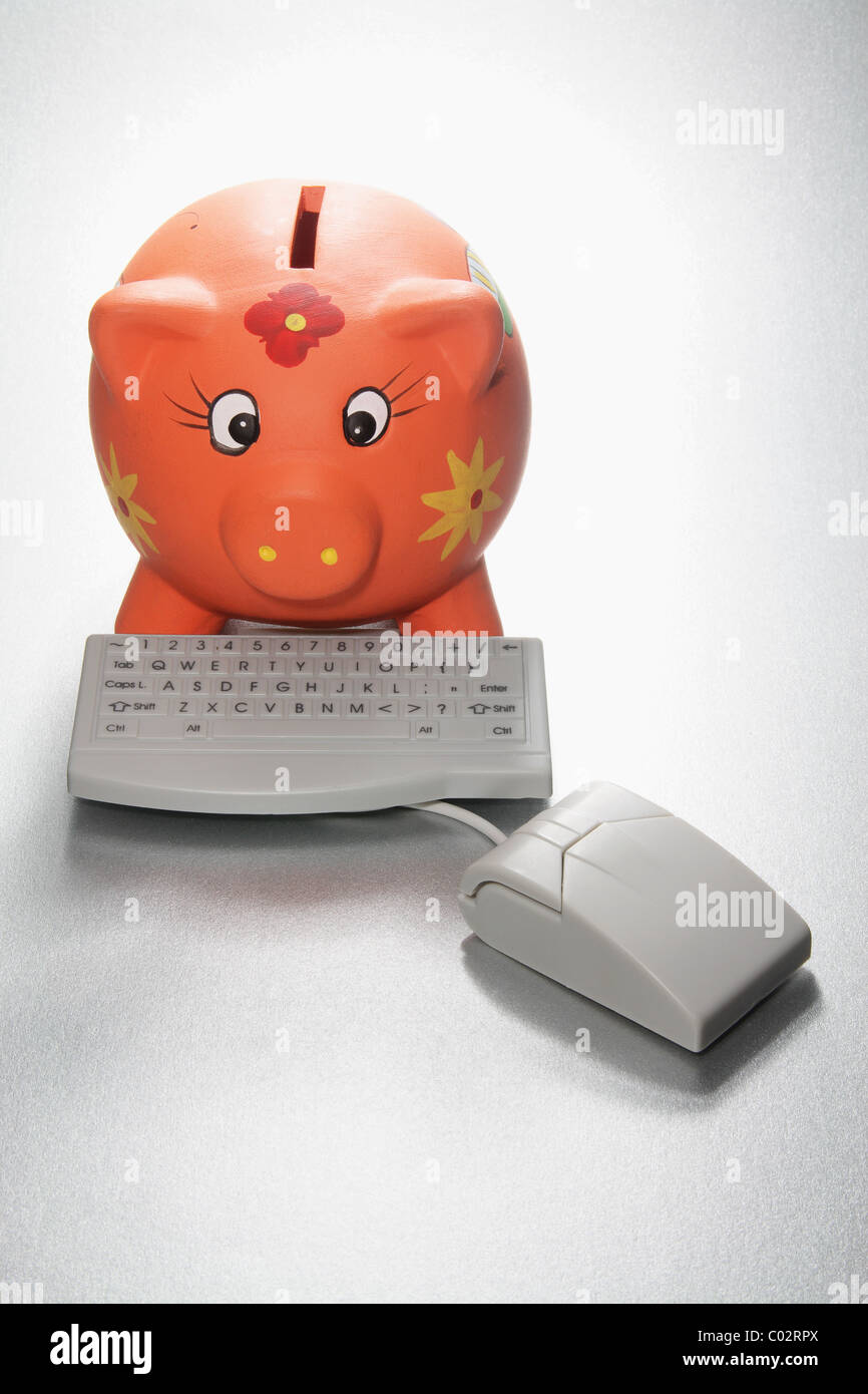 Piggy Bank and Computer Keyboard Stock Photo - Alamy