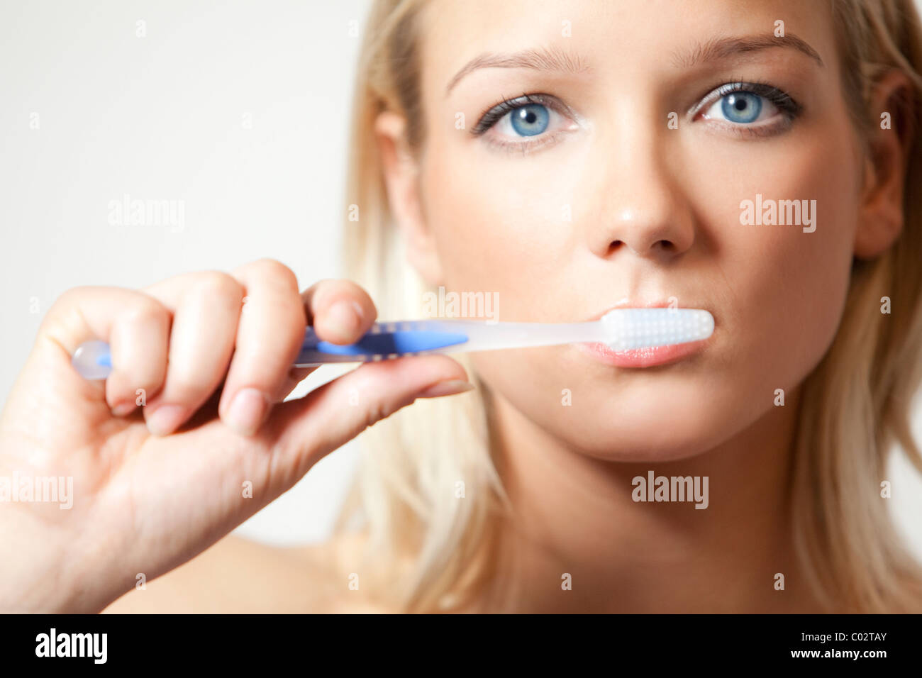 woman with a toothbrush Stock Photo - Alamy