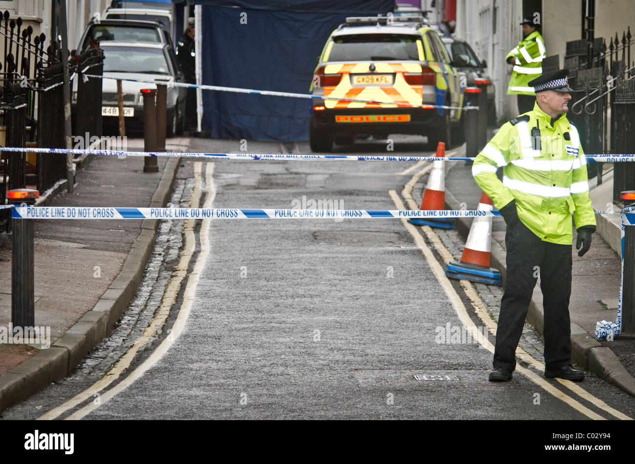 Police investigate the crime scene where police shot dead a suspect ...