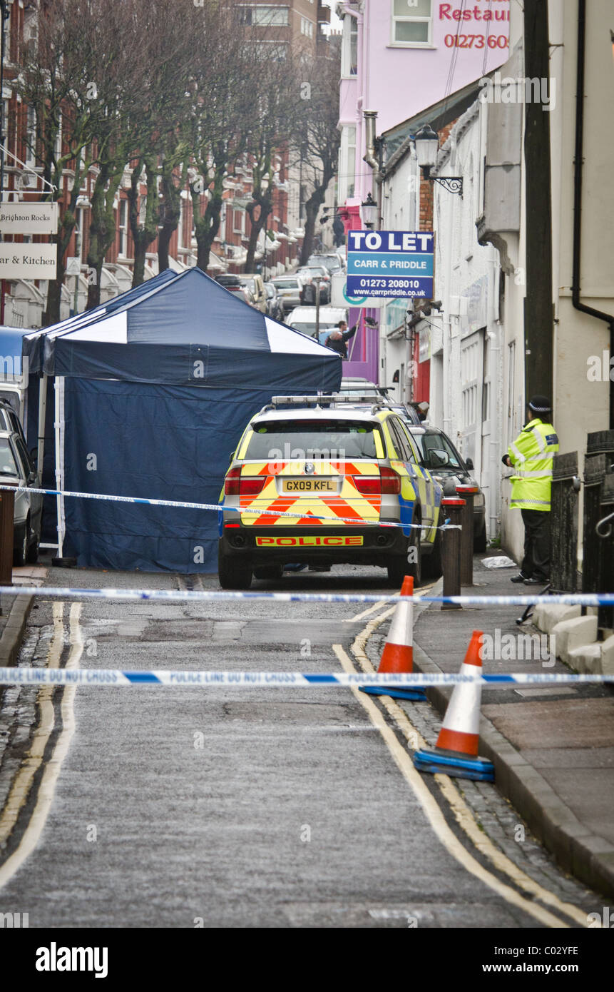 Police investigate the crime scene where police shot dead a suspect ...