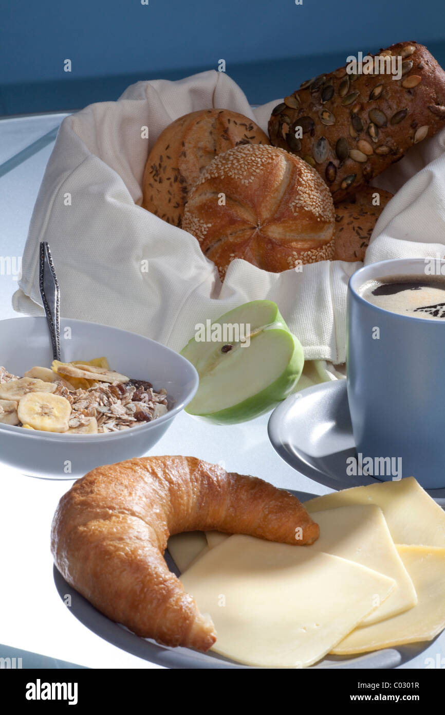 Set breakfast table with coffee, rolls, cereal, and apple Stock Photo ...