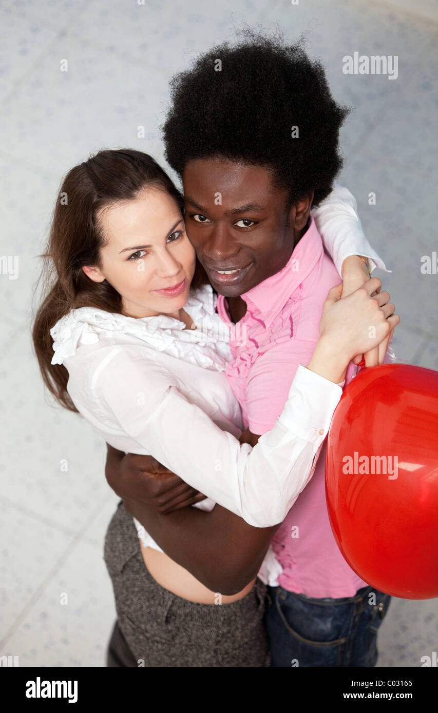 couple, holding heart shaped balloon, hug Stock Photo - Alamy