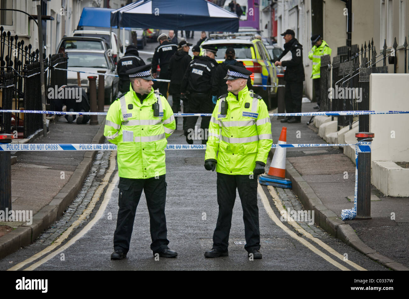 Police investigate the crime scene where police shot dead a suspect ...