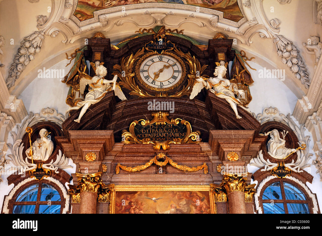 Richly decorated clock over the altar of the monastery church of St ...