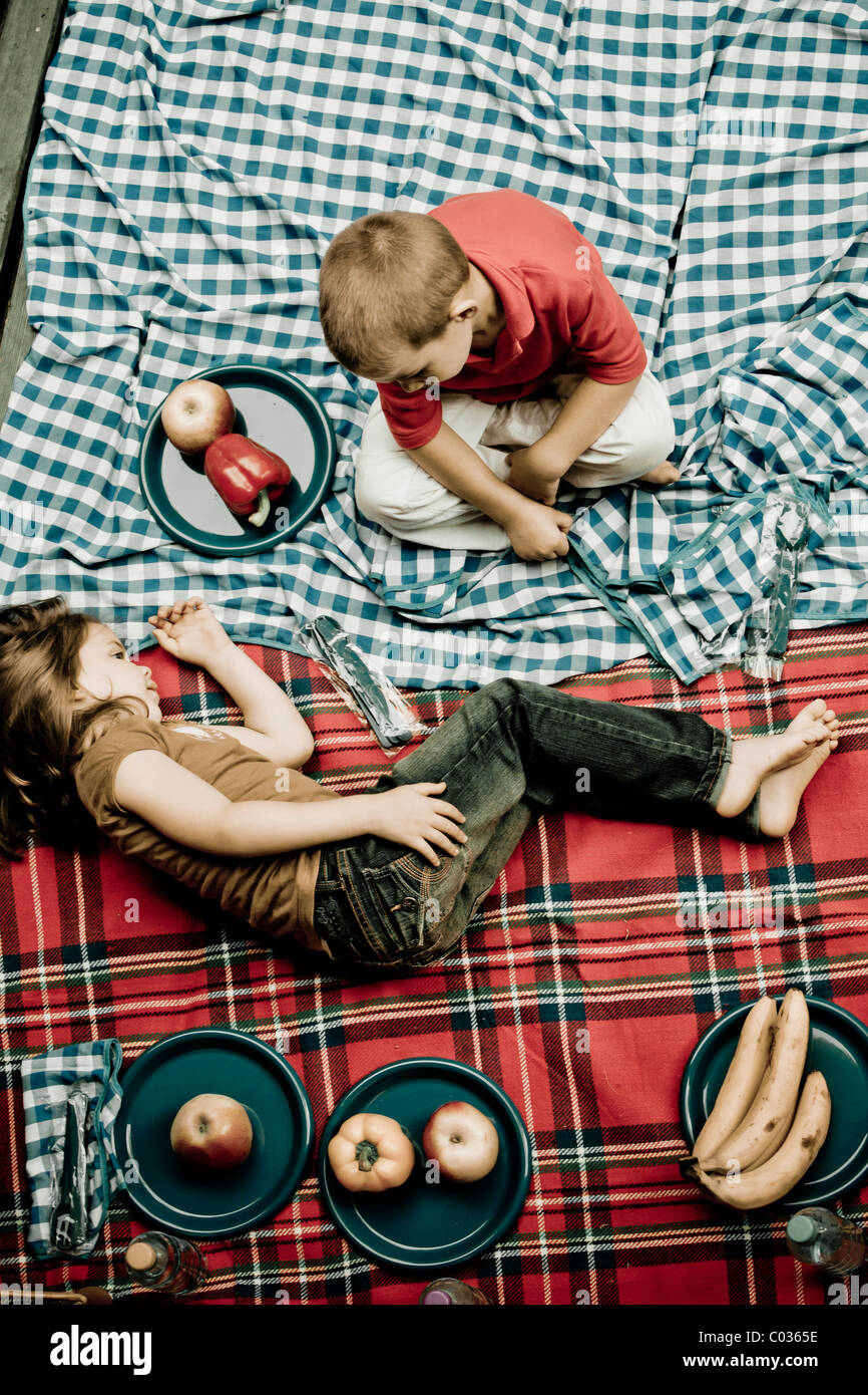 two kids relaxing during a play game Stock Photo - Alamy
