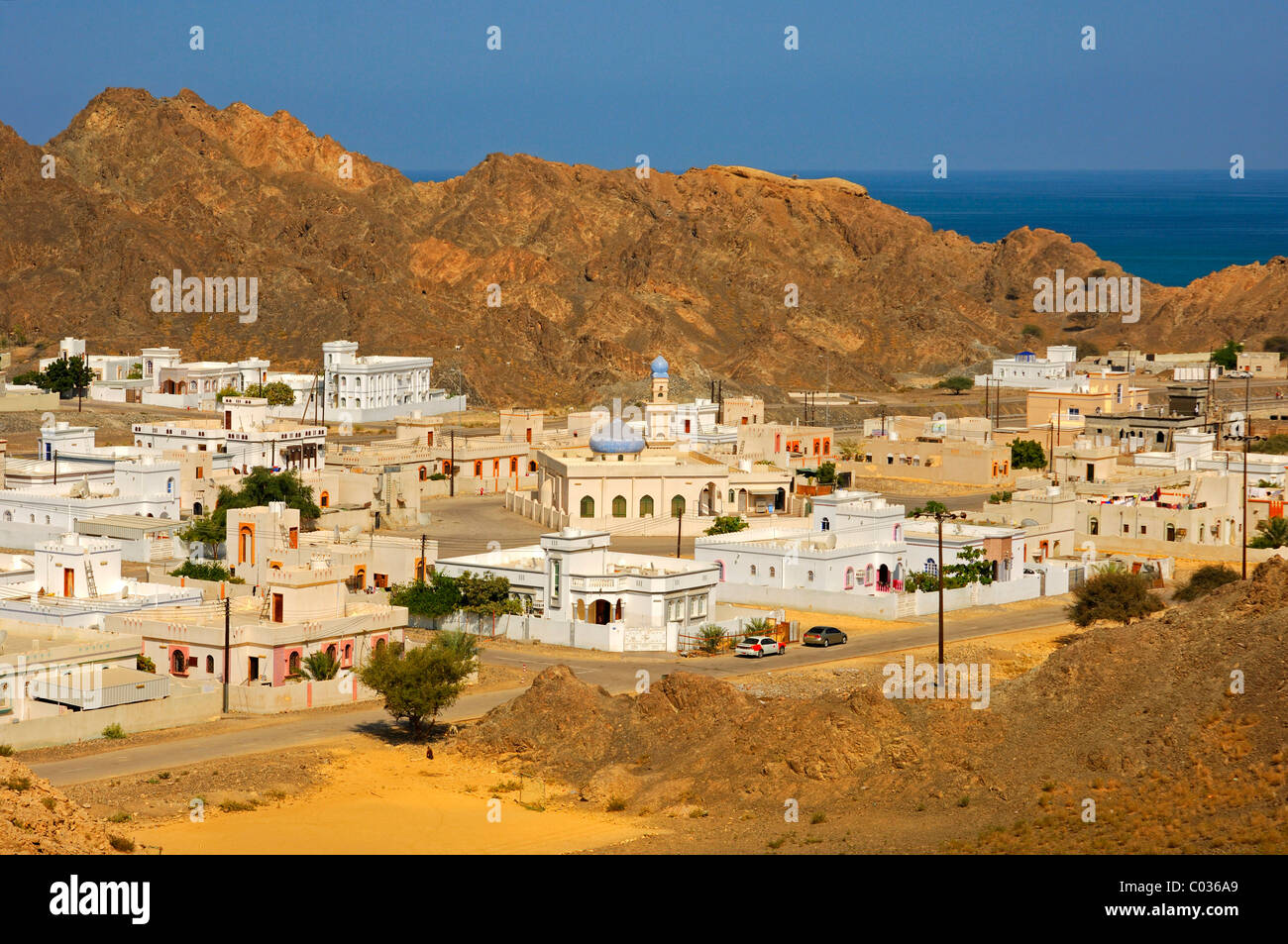 The village of Al Bustan nestled between the Gulf of Oman and barren ...