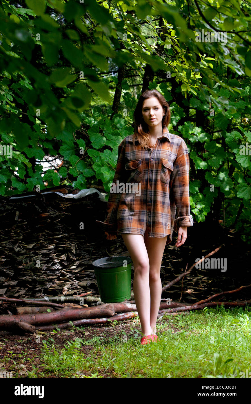 Woman with bucket Stock Photo - Alamy