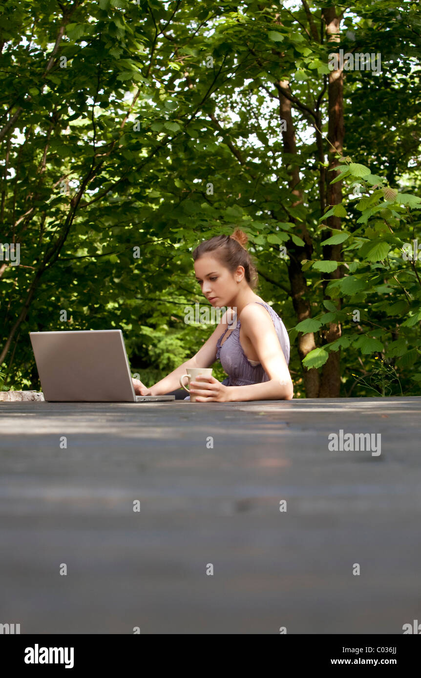girl with a laptop, outdoor Stock Photo - Alamy