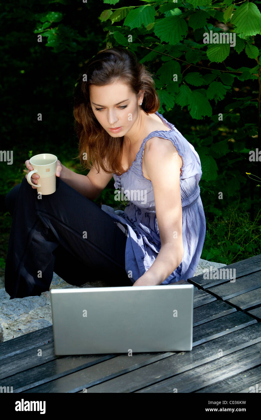 girl with a laptop, outdoor Stock Photo - Alamy