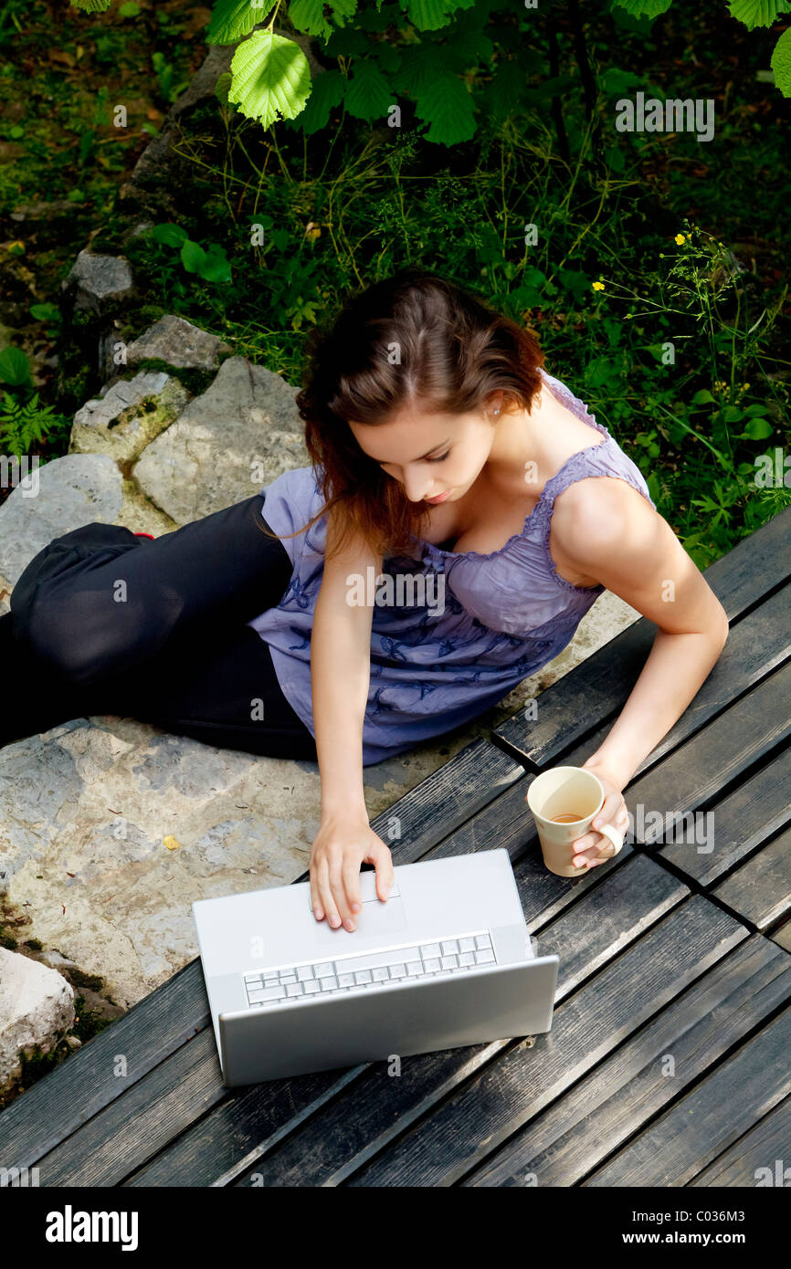 girl with a laptop, outdoor Stock Photo - Alamy