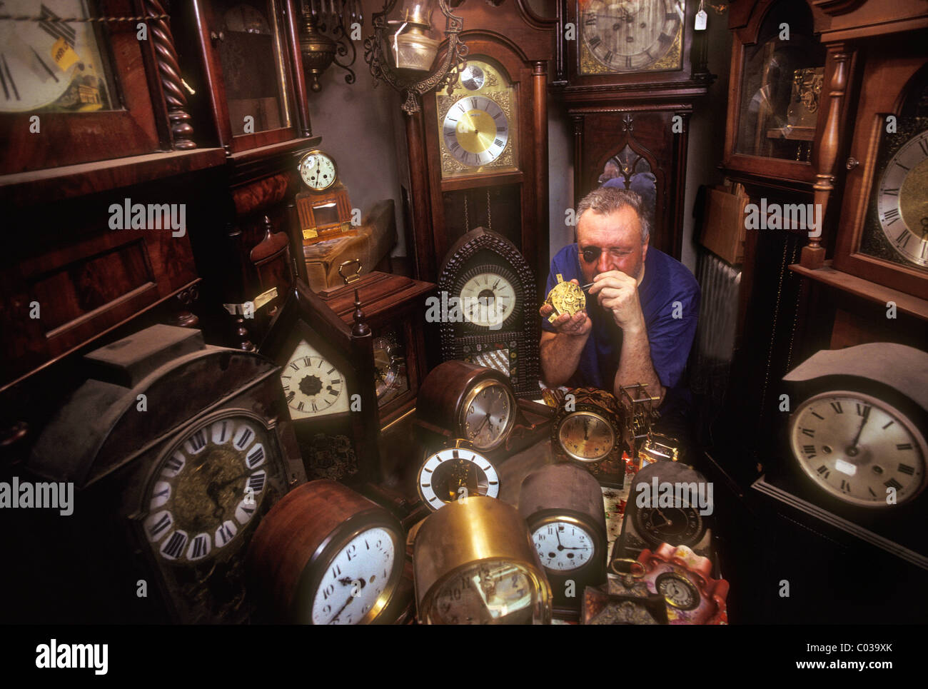 Clock repair man Stock Photo - Alamy