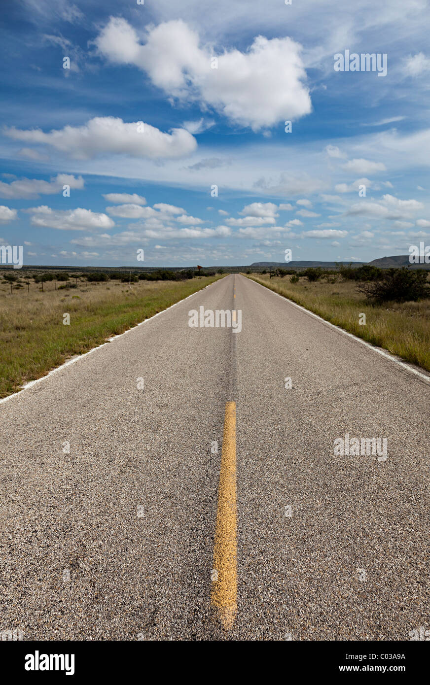 Open empty road and blue sky with clouds, Guadalupe Mountains, New ...