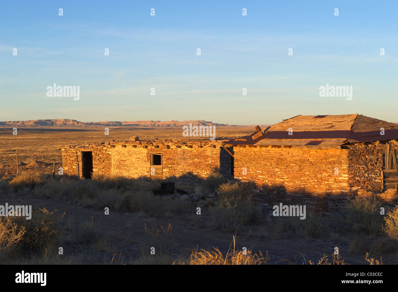 Abandoned stone houses at dusk with Second Mesa in the background Stock ...
