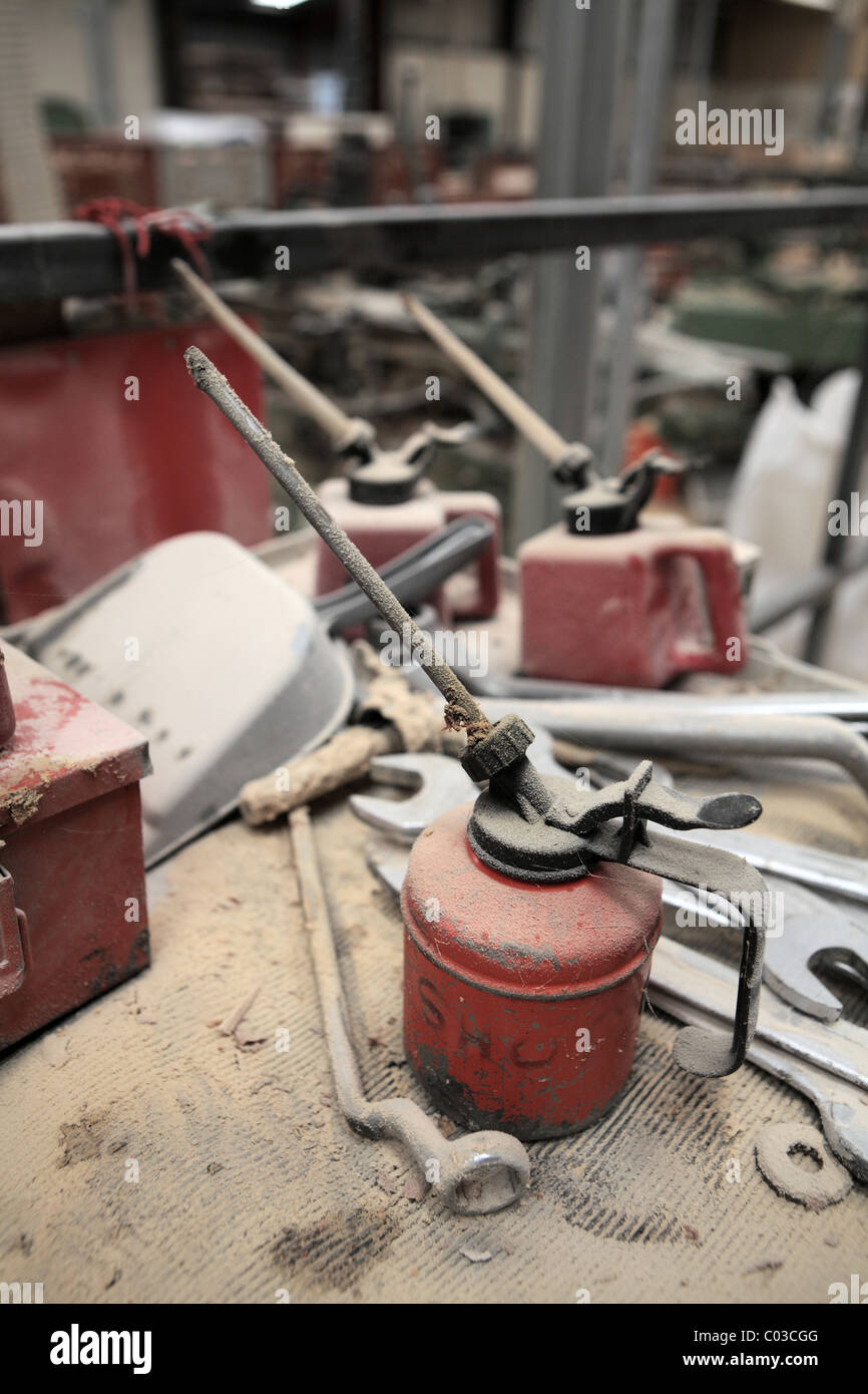 Oil cans in workshop Stock Photo - Alamy