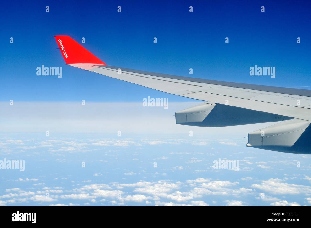 Above the clouds, sky, wing, logo of Airberlin airline company ...