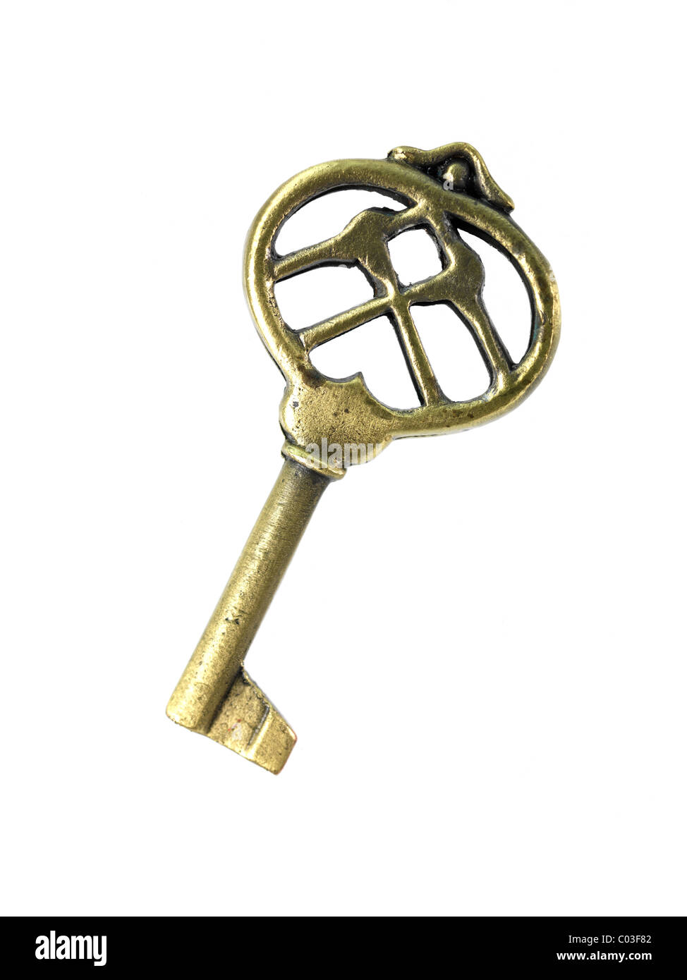 A vintage brass key isolated against a white background Stock Photo - Alamy