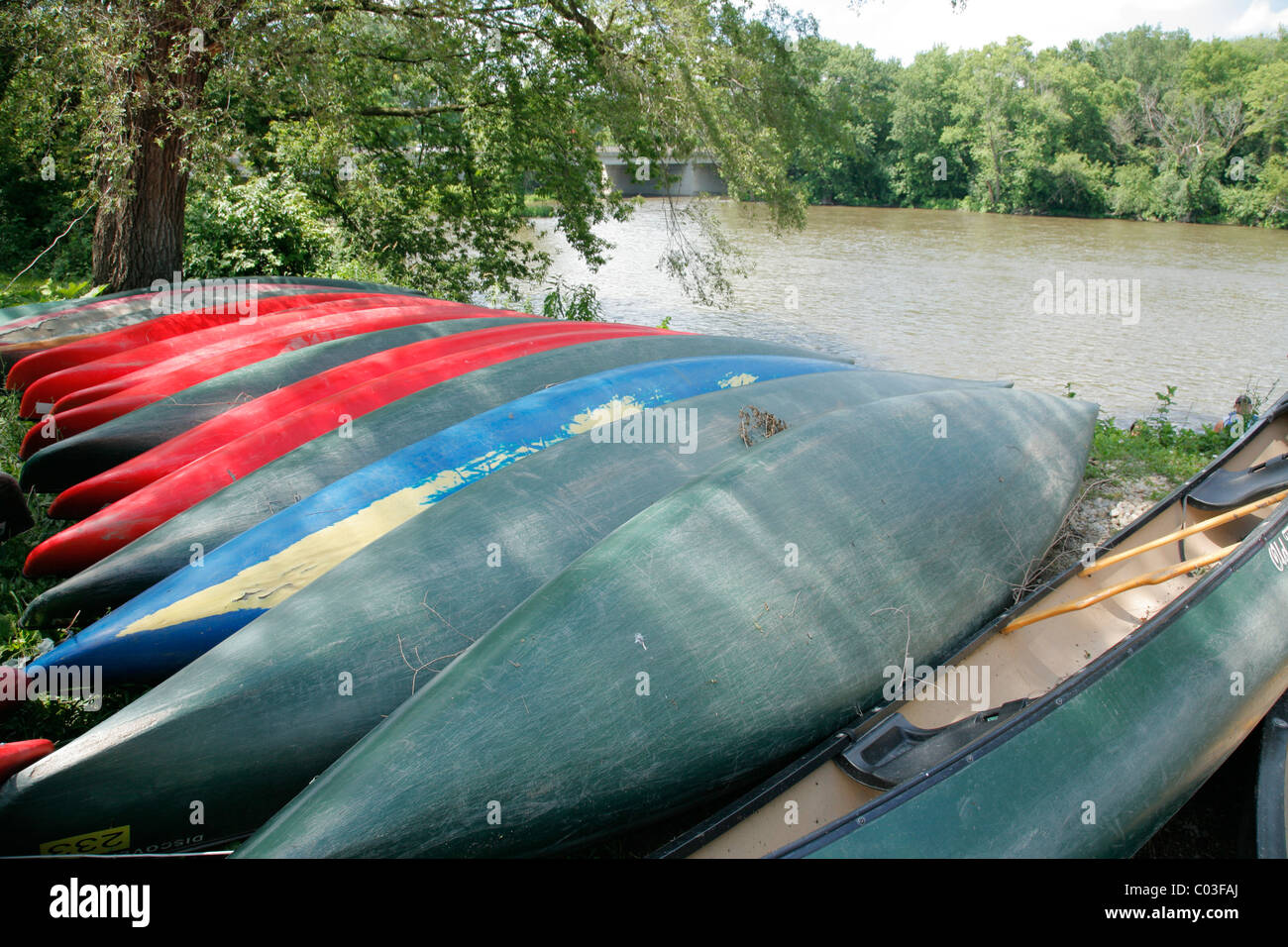 Canoes line up on land in preparation for use on a river trip Stock ...