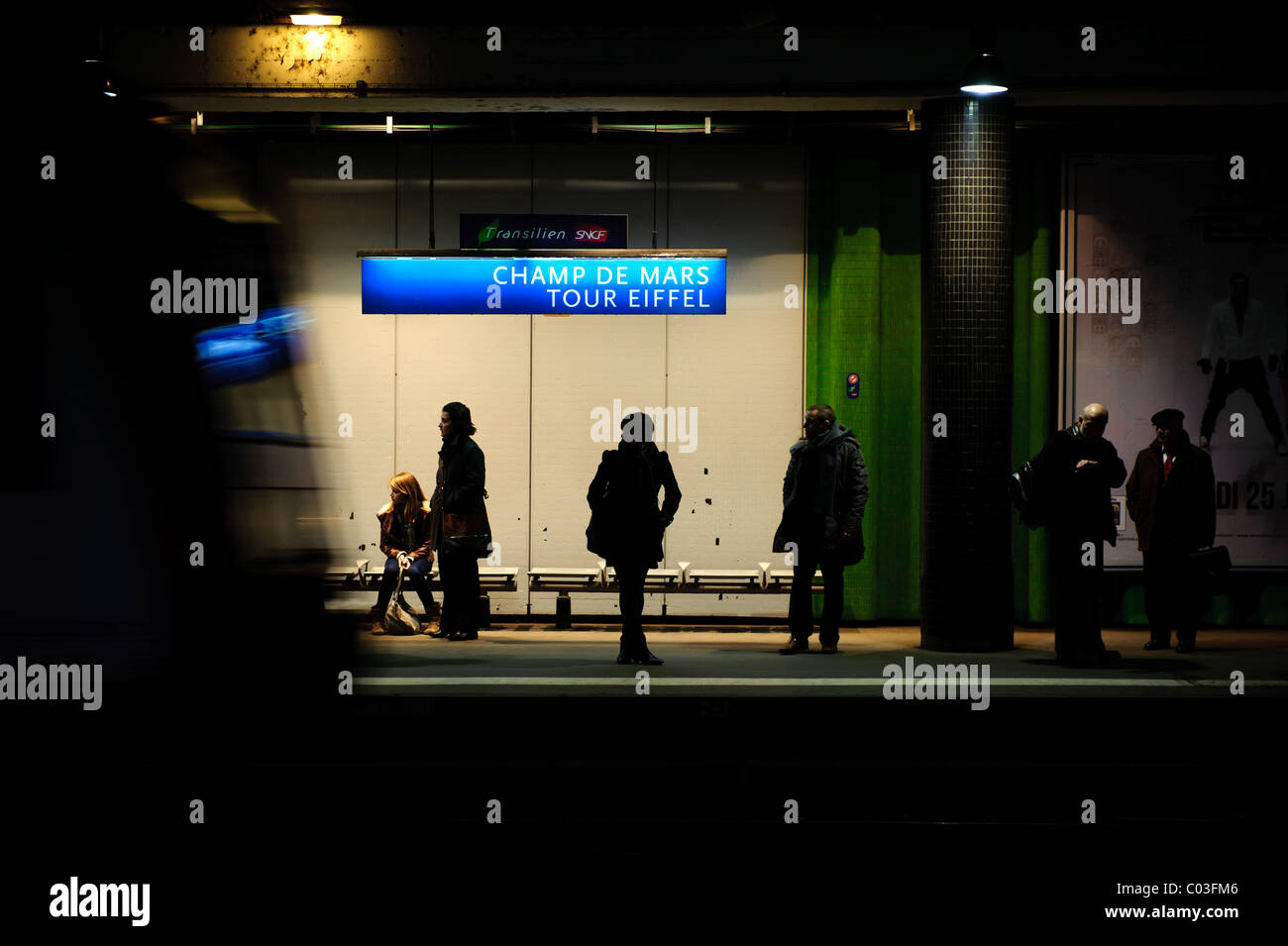 Passengers wait for a metro train at station Champ De Mars serving the ...