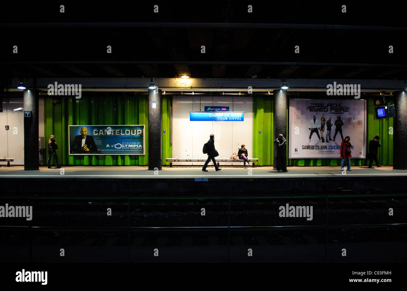 Passengers wait for a metro train at station Champ De Mars serving the ...