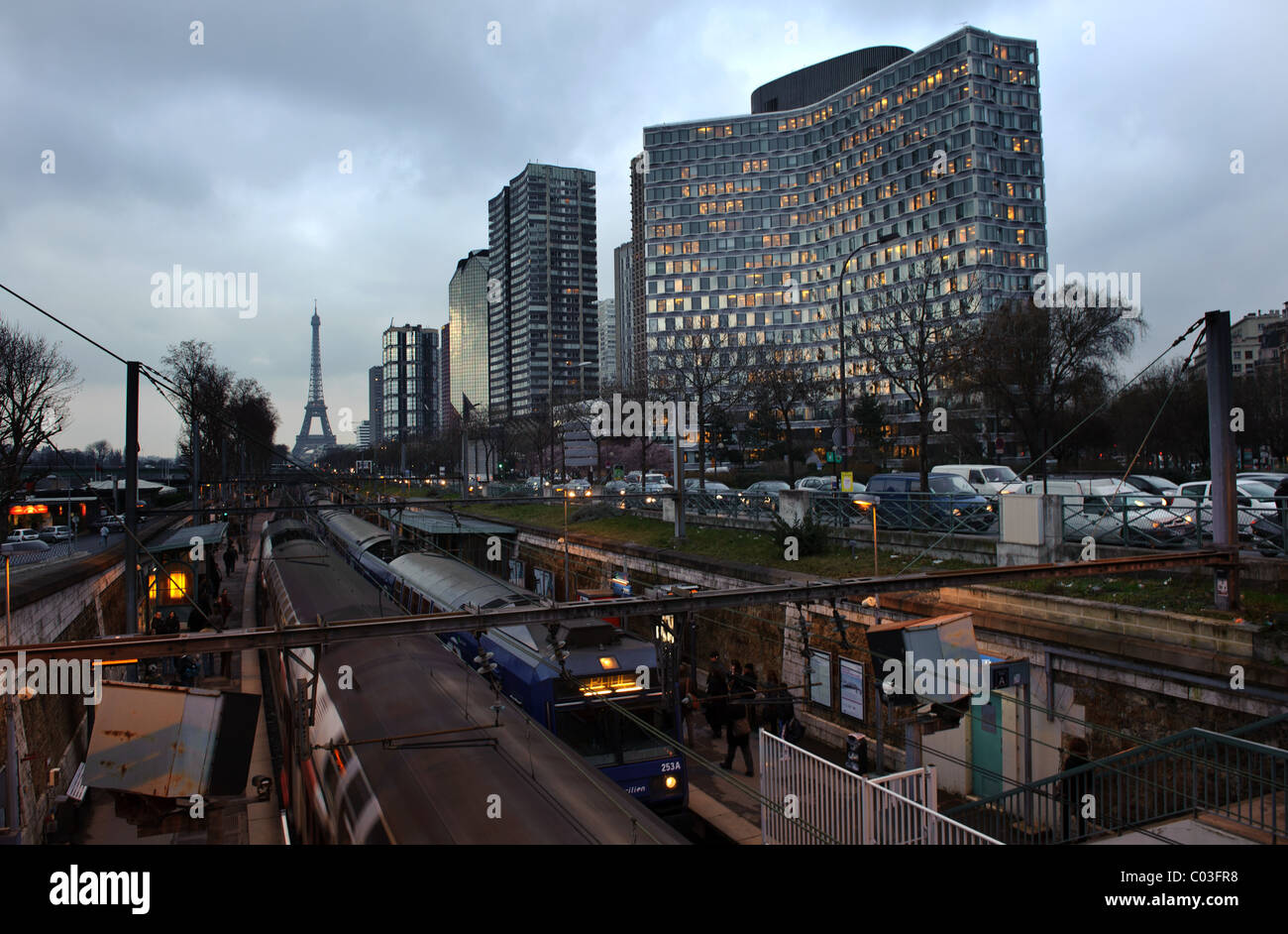 A train arrives at the Javel Metro Station with the Eiffel Tower in the ...