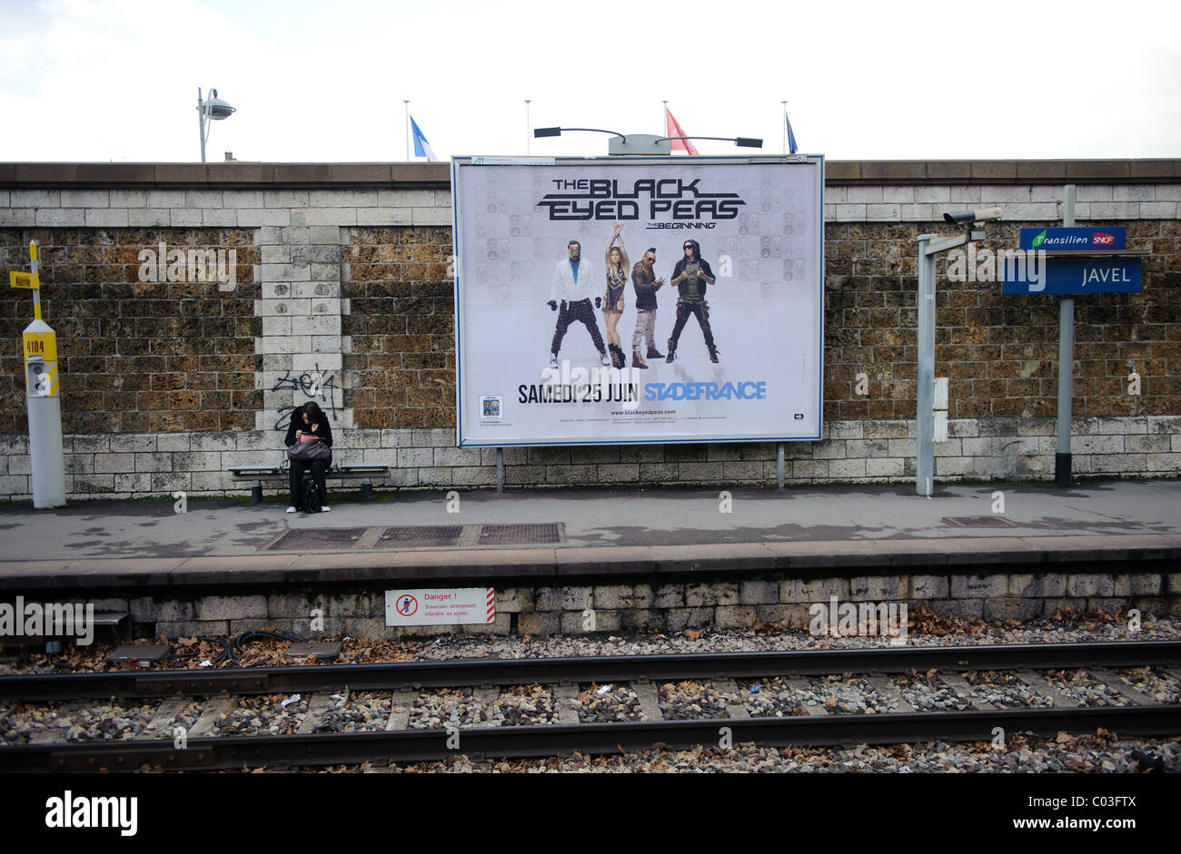 Javel metro station with a poster advertising a concert of rock group ...