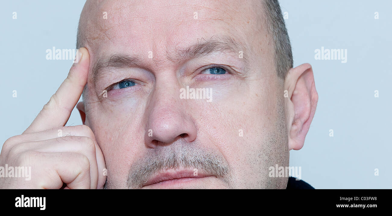 A man with a thinking expression Stock Photo - Alamy