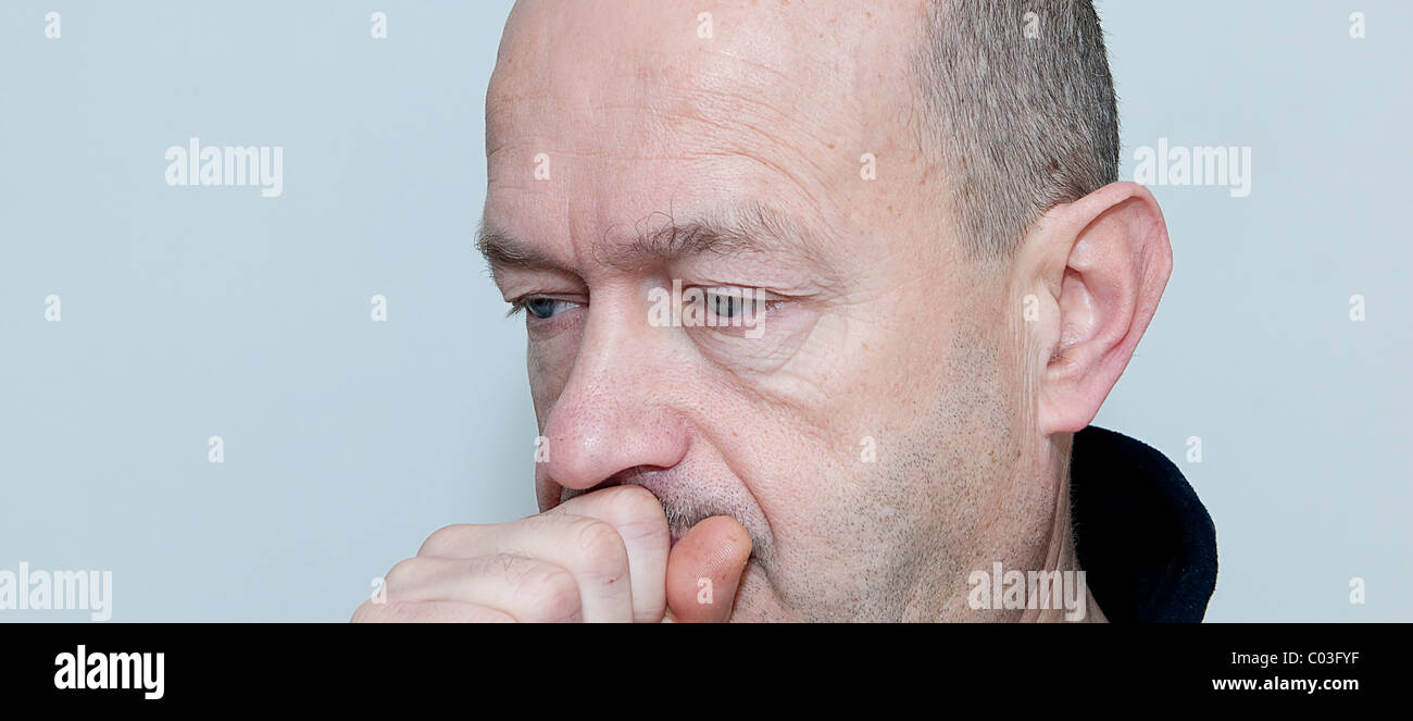 A man with a thinking expression Stock Photo - Alamy