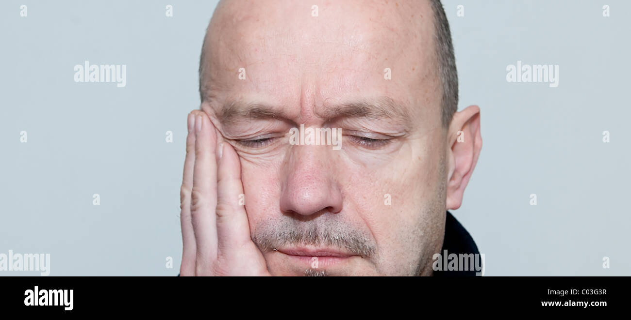 A man with teeth ache Stock Photo - Alamy