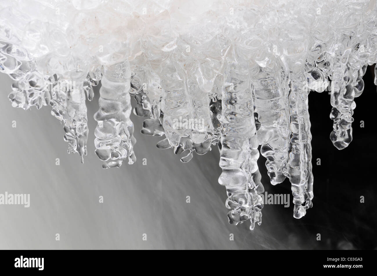 Ice and icicles on a waterfall Stock Photo - Alamy