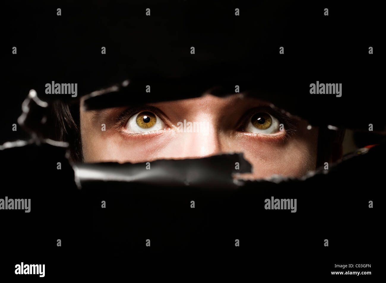 Man spying through hole in hi-res stock photography and images - Alamy