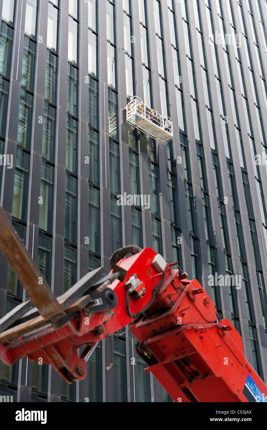 Window cleaner on the facade of a skyscraper Stock Photo - Alamy