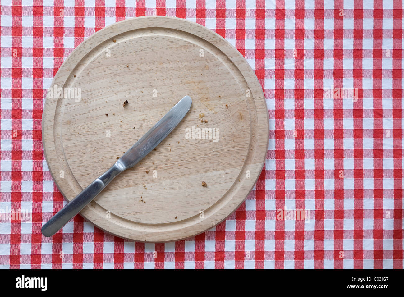 Empty breakfast plate with a knife, top view Stock Photo - Alamy