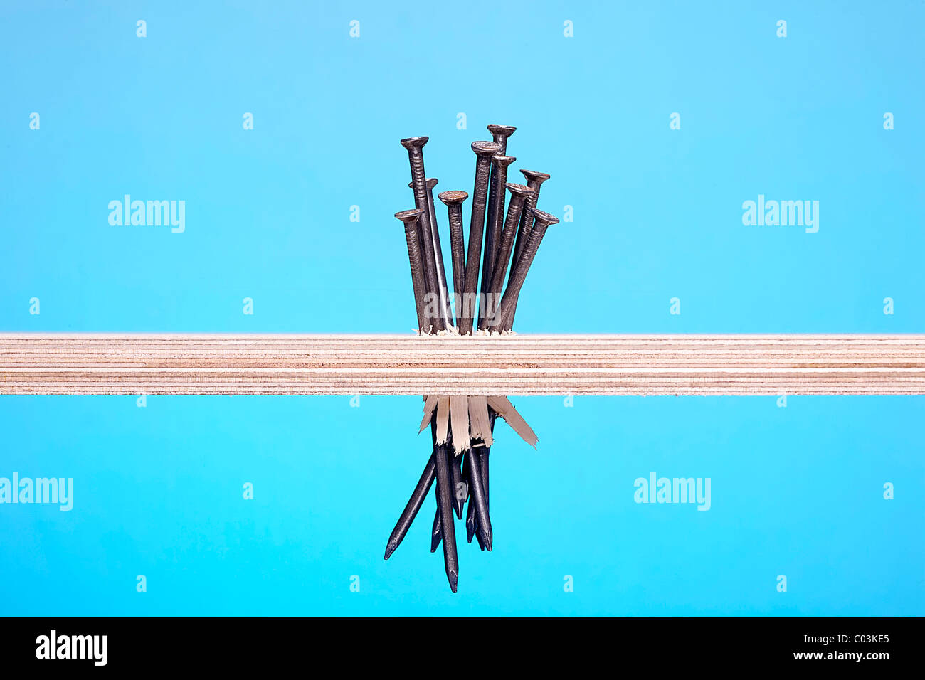Nail stuck in board hi-res stock photography and images - Alamy