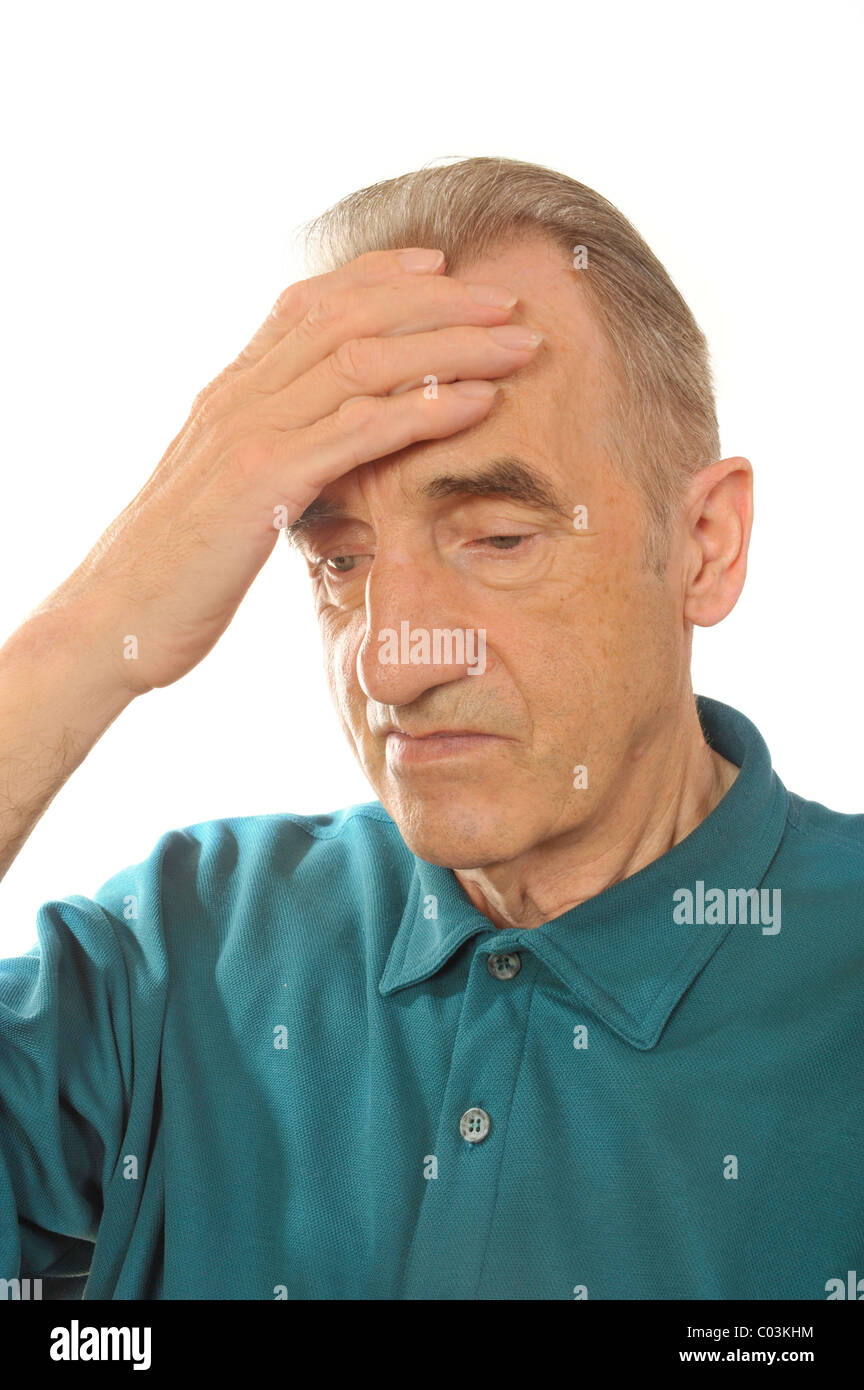 Man with headache touching his forehead Stock Photo - Alamy