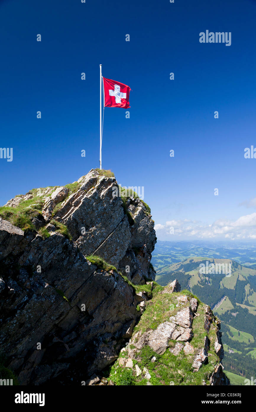 Swiss flag on a mountain in the Alpstein Range, Appenzell, Switzerland ...