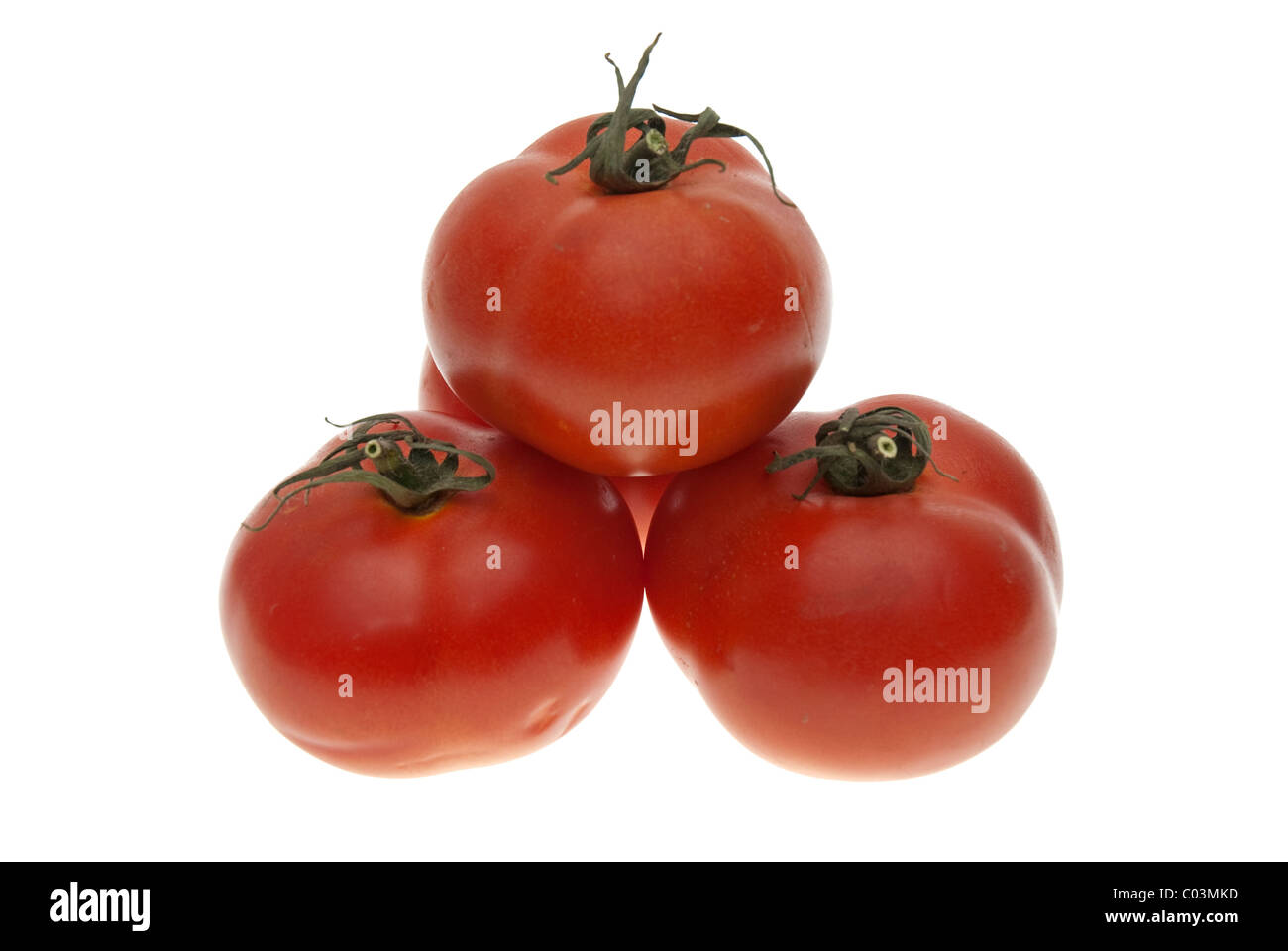 Three red tomatoes isolated on white background Stock Photo - Alamy
