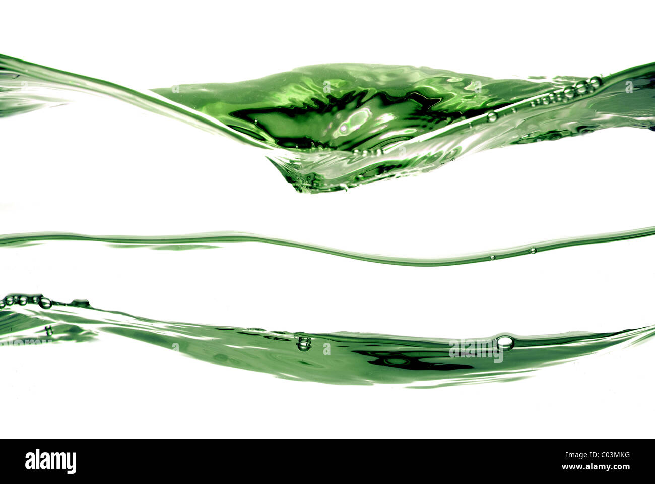 Green water waves flowing isolated on white background Stock Photo - Alamy