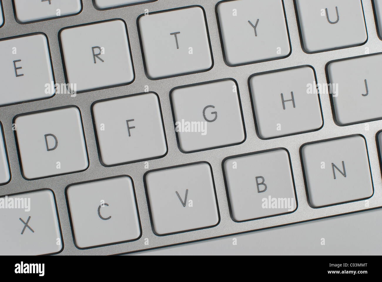 Closeup of a modern aluminium keyboard, focus on center keys Stock ...