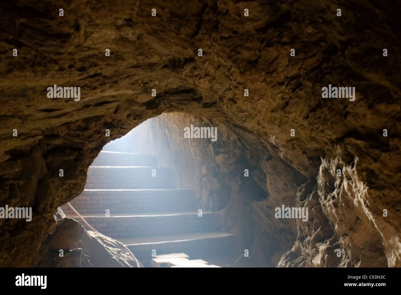 Stone steps are leading to an underground cave at a Buddhist temple in ...