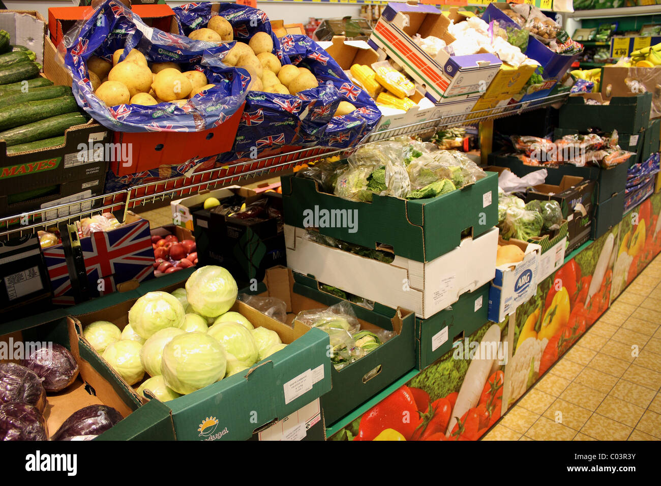 A supermarket with freshly grown vegetables and other produce for sale ...