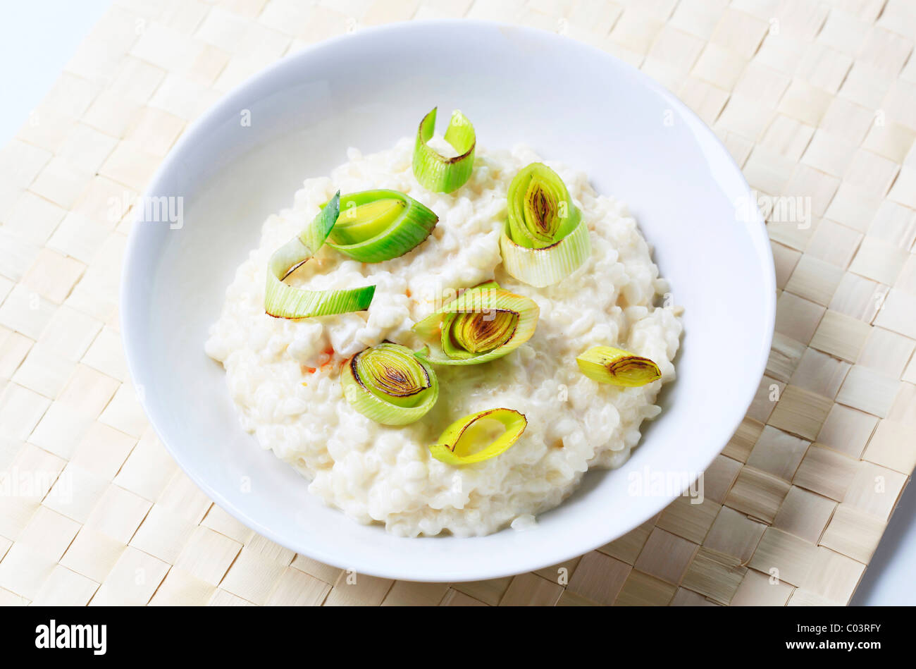 Bowl of rice pudding with leek - closeup Stock Photo - Alamy