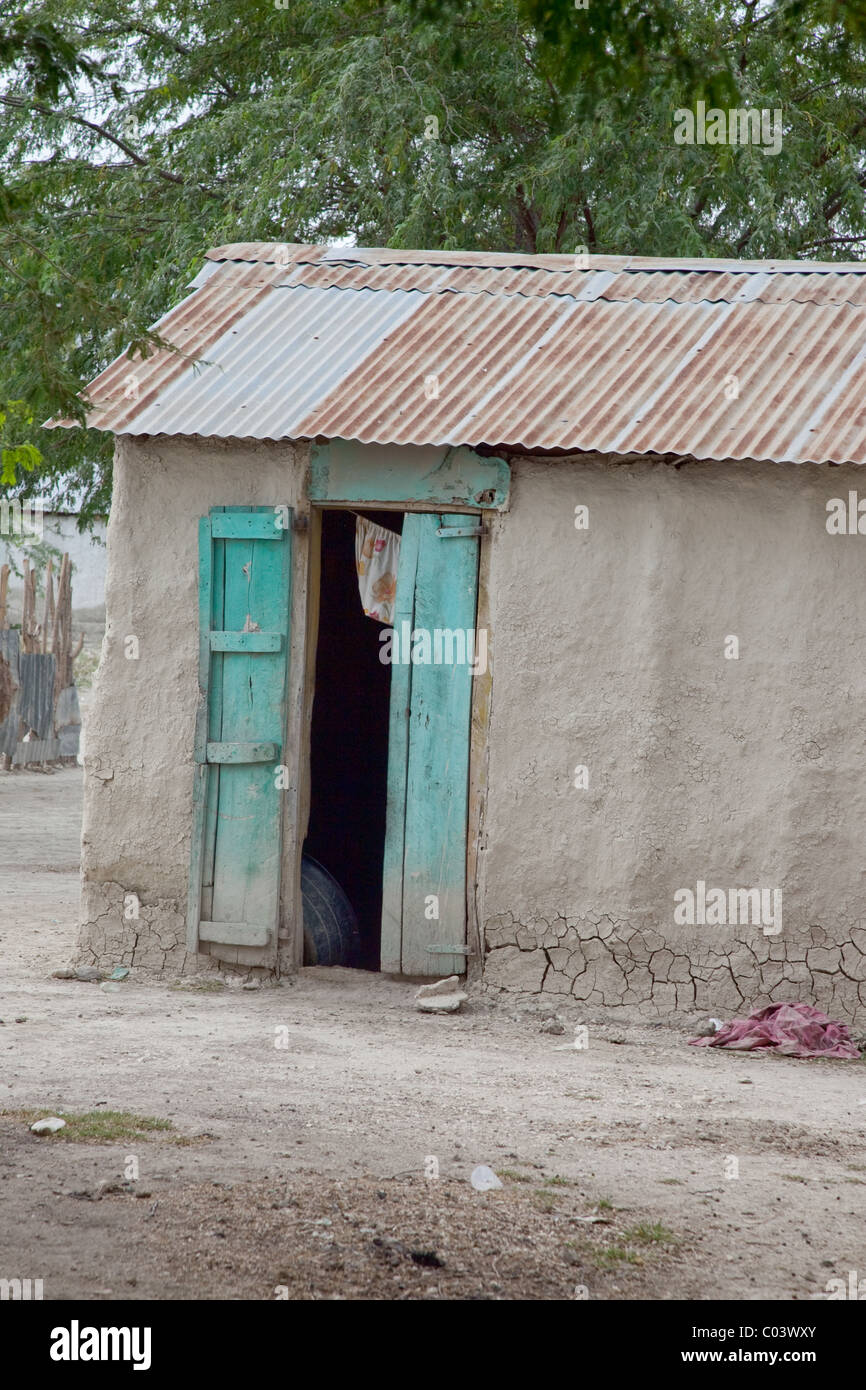 Mud and stick hut with its door open Stock Photo - Alamy