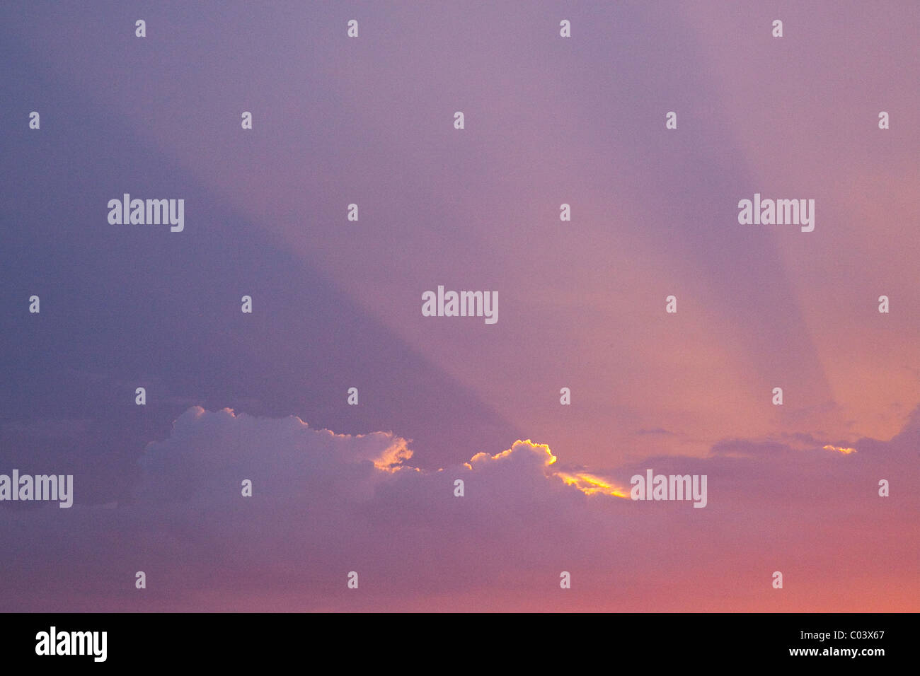 Sun behind clouds Stock Photo - Alamy