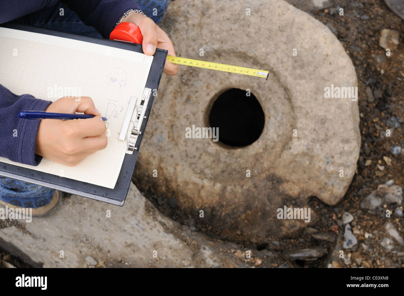 Taking measures to a drain in the " Domus "Archaeological site " Chao ...