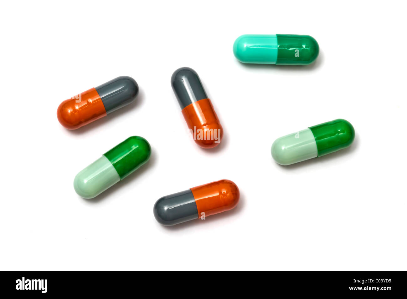 A few colorful capsules isolated on white background Stock Photo - Alamy