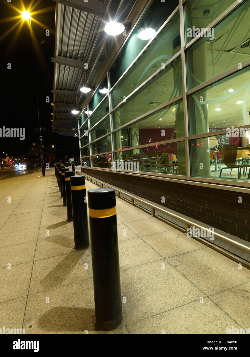 Frontage of large store at night Stock Photo - Alamy