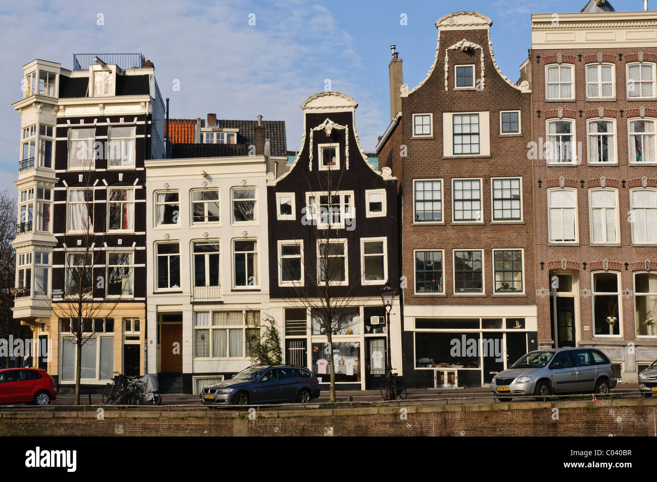 Uneven buildings in Amsterdam Stock Photo - Alamy