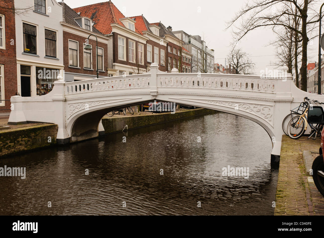 White stone bridge over a canal in Delft, Holland, The Netherlands ...