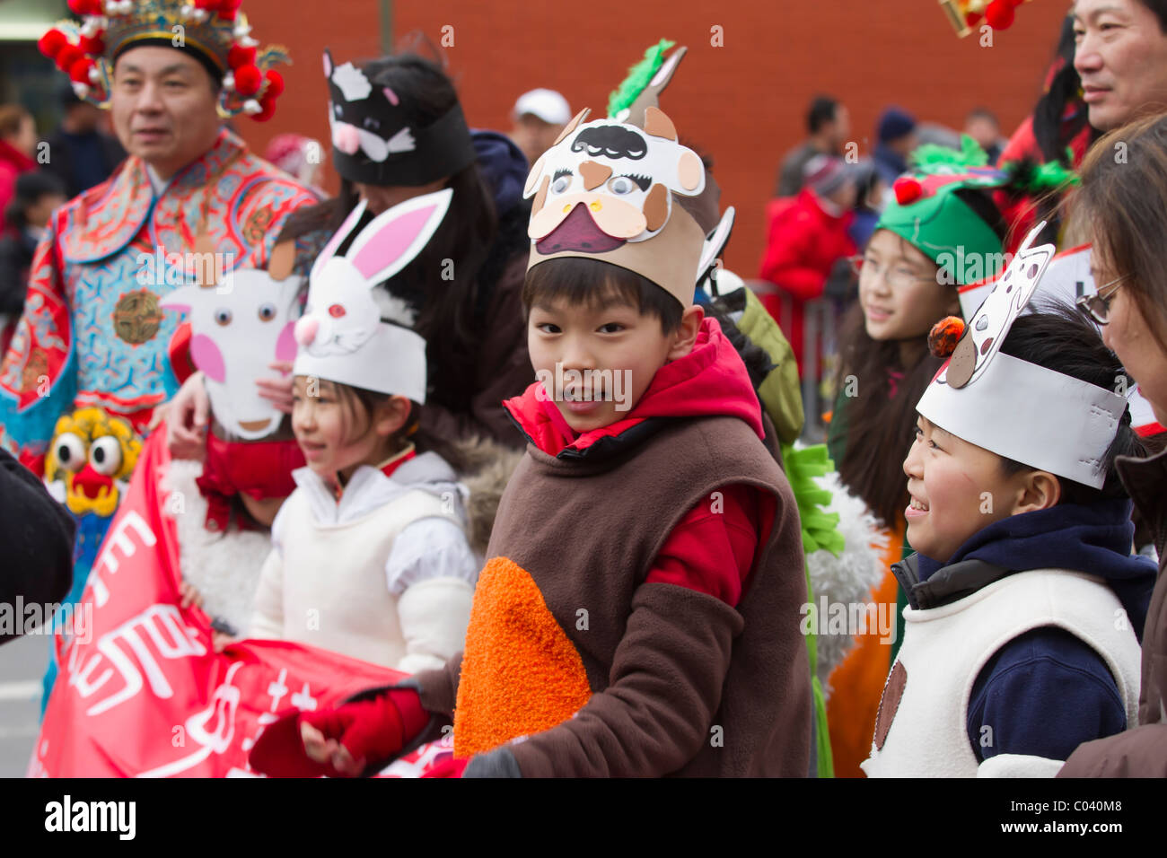 Boys and girls dressed as rabbits marching in the 2011 Lunar New Year ...
