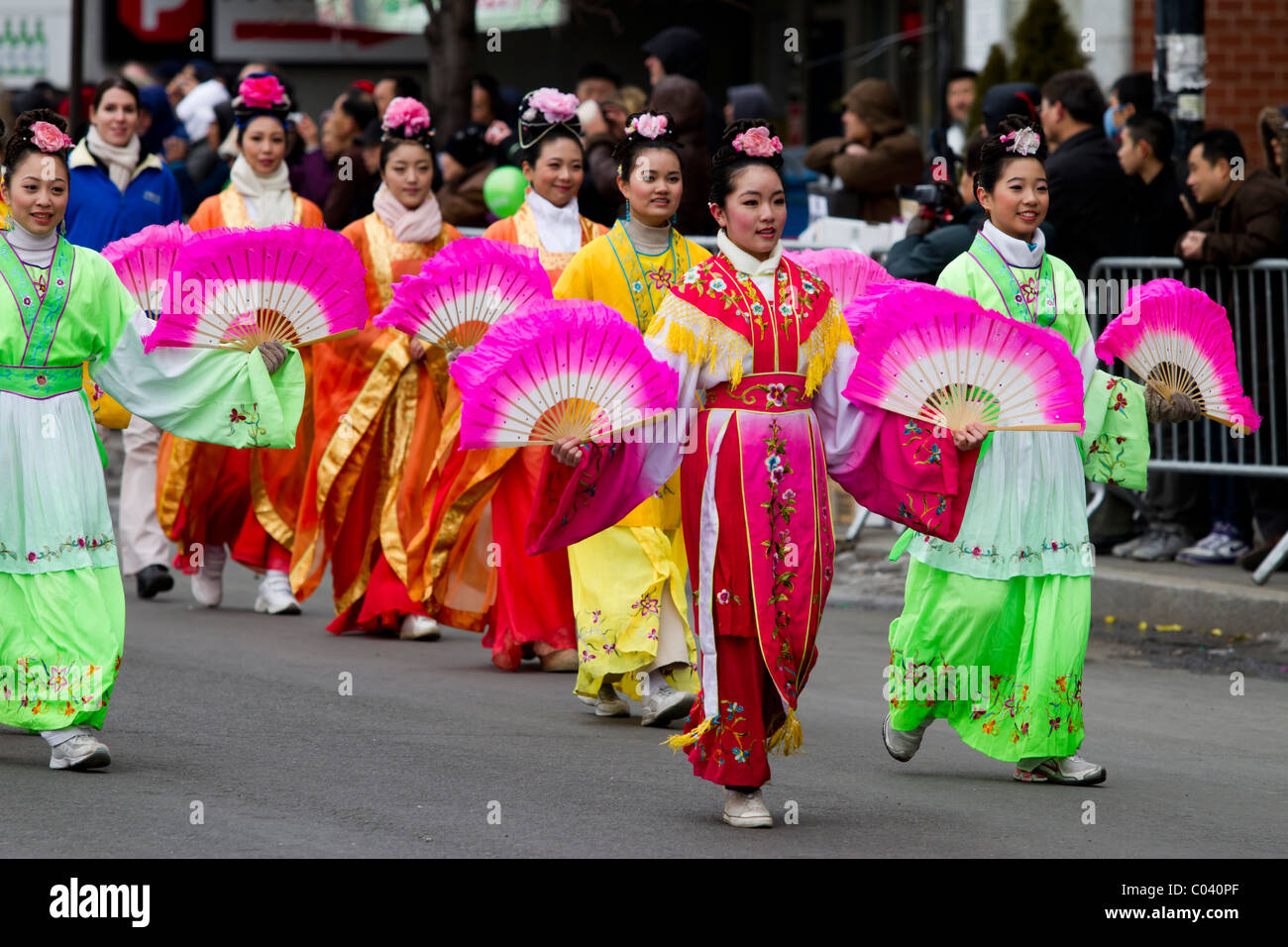 Falun Gong women in traditional Chinese costumes participate in the ...